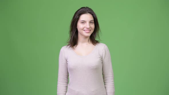 Young Beautiful Woman Nodding Yes Against Green Background, Stock Footage