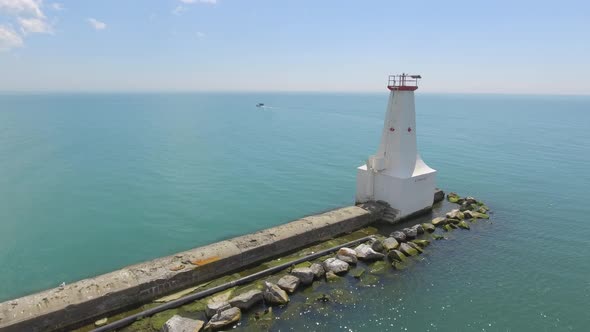 aerial amazing lighthouse rotating view with background scenery moving ...
