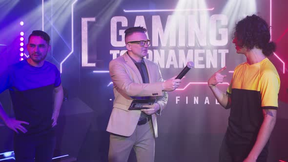 Male Announcer Interviewing Team Leaders During Esports Competition ...