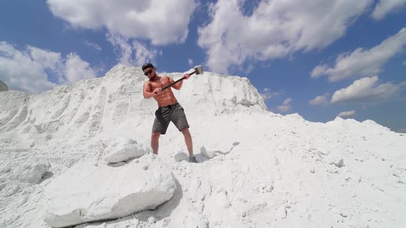 Man doing hammer strike during exercise outside. Sport fitness man ...