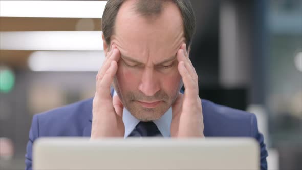 Portrait of Businessman Having Headache While Using Laptop, Stock Footage