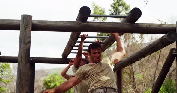 Military soldiers climbing monkey bars, Stock Footage | VideoHive