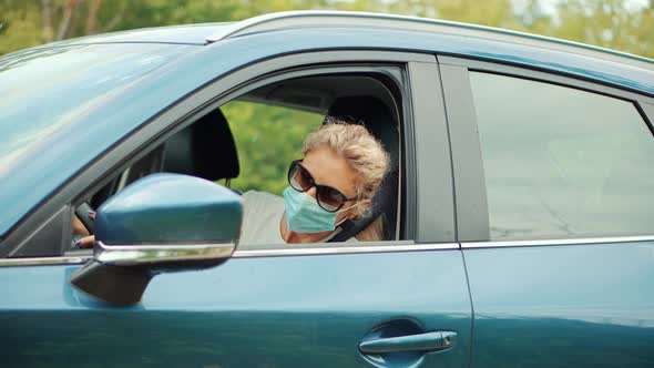Driver Protective Face Mask In Car. Businessman In Sunglasses Drive ...