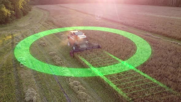 Aerial view of a self-driving autonomous combine harvester harvesting ...