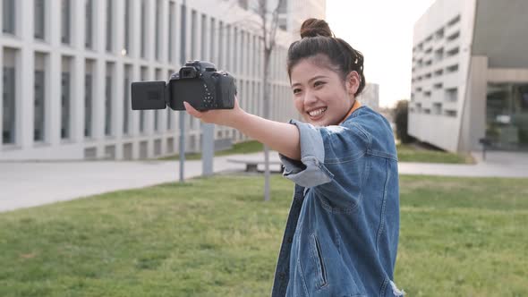 Asian woman vlogging and using camera, social media influencer content ...