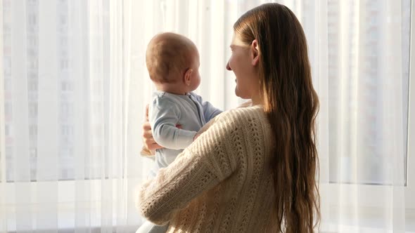Cute Baby Looking at Smiling Mother at Big Endow in Sunset Light, Stock ...