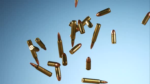 Bullets falling bouncing in ultra slow motion 1500fps on a reflective ...