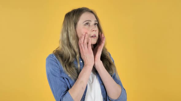 Pretty Girl Confused and Scared of Problems on Yellow Background, Stock ...
