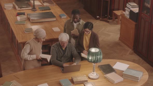 Senior Professor and Students Studying in Library, Stock Footage ...