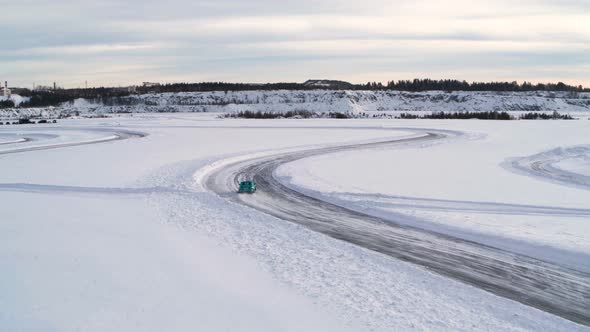 Aerial view of a racing car at an ice rally, Stock Footage | VideoHive