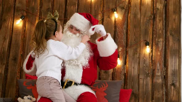 Cute Little Girl Pulling Santa's Beard To Check If It's Real Sitting on ...