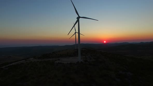 Flying over windmills at dusk, Stock Footage | VideoHive