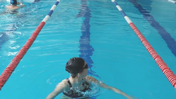Fit Swimmer Girl Jumping and Cheering in Swimming Pool, Stock Footage