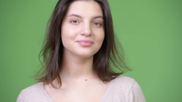 Young Beautiful Woman Nodding Yes Against Green Background, Stock Footage