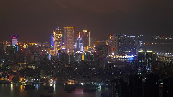 Macau Peninsula Aerial Cityscape Night Timelapse Pan Up, Stock Footage