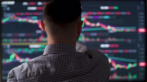 Male Trader Working with Set for Analyzing Financial Statistics and ...