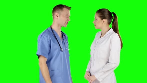 Two Young Doctors Talking Together. Green Screen, Stock Footage | VideoHive