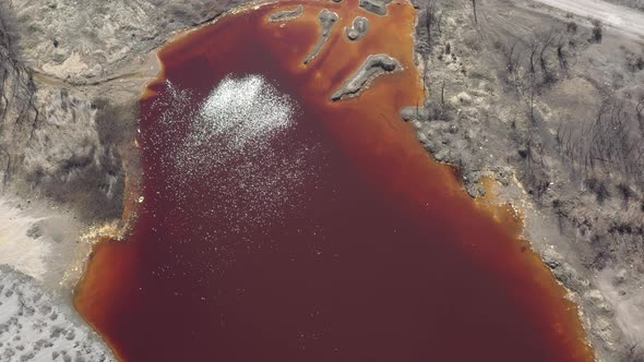 Red acidic water from mining process 4K aerial video, Stock Footage