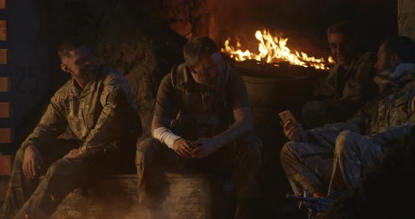 Military Men Resting Around Campfire, Stock Footage | VideoHive