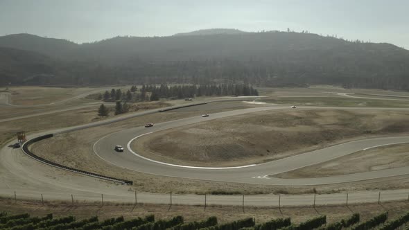 Exotic sports cars driving on a racing circuit, Osoyoos race track ...