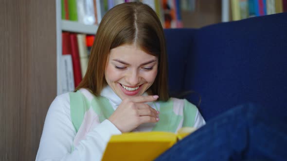 Woman Reading Funny Book and Laughing, Stock Footage | VideoHive