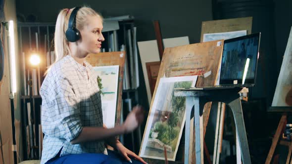 Blond Woman is Having a Remote Art Lesson, Stock Footage | VideoHive