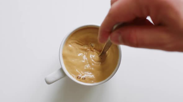Person Hand Stirring Coffee with Spoon, Stock Footage | VideoHive