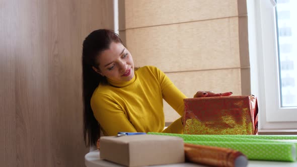 Girl at Home Fiddling with Gifts, Stock Footage | VideoHive
