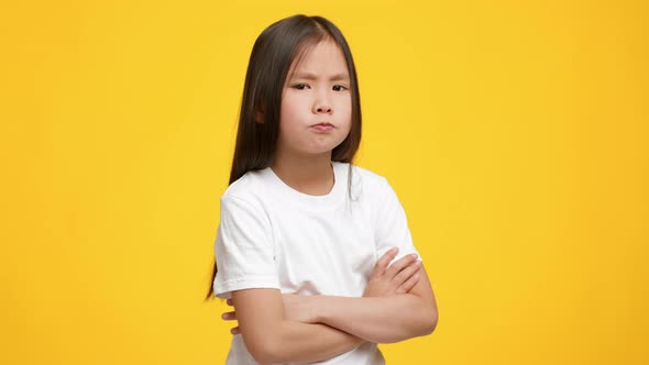 Importantlooking Asian Little Girl Nodding Head Crossing Hands Yellow ...