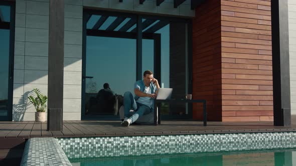Rich Man Talking Mobile at Luxury House Near Swimming Pool., Stock Footage