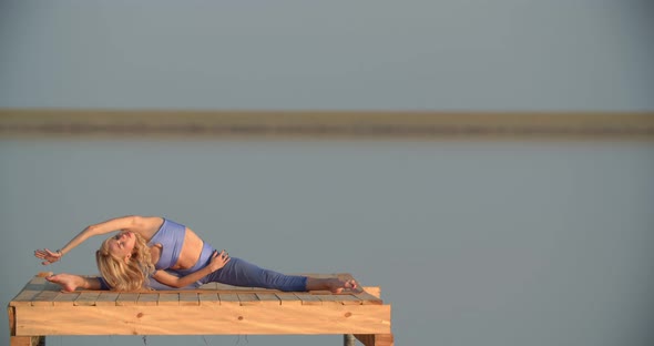 Flexible and Athletic Young Woman with Blonde Hair is Doing a Split ...