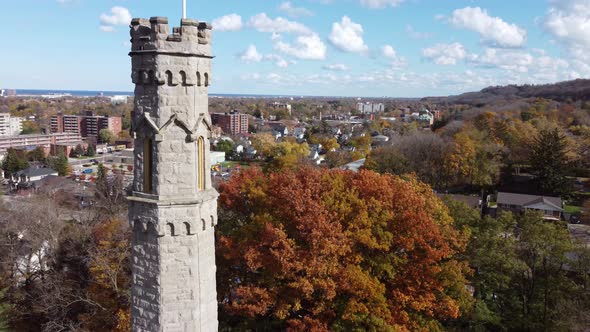 Aerial circular pan around historic watchtower of battlefield monument ...