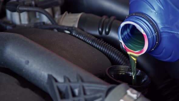 New Engine Oil Is Pouring Into The Car Engine At Workshop 3, Stock Footage