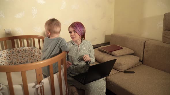 Mother is Distract By Small Child From an Online Interview, Stock Footage