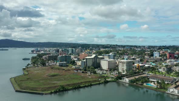 Hotels and resorts on coast of capital Suva in Fiji, aerial shot, pan ...
