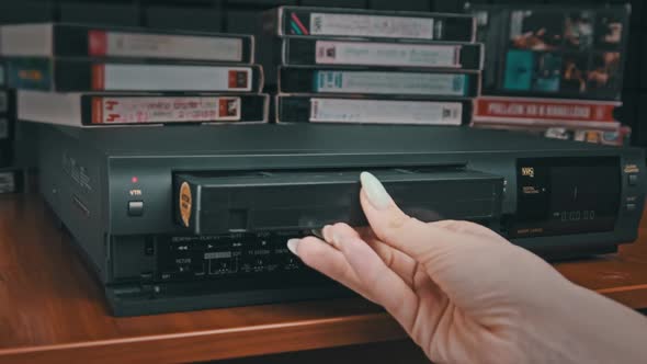 Insert VHS Cassette Into VCR and Push Play Button, Stock Footage ...