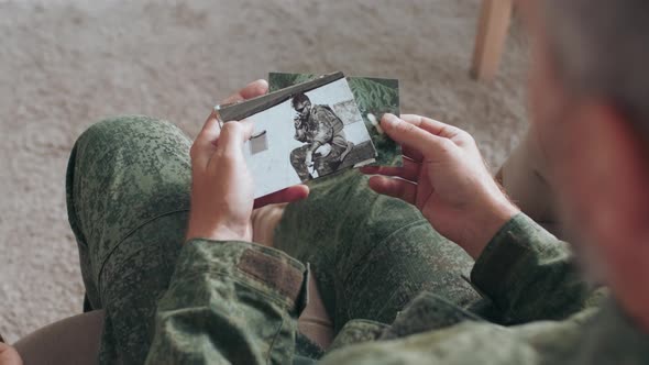 Army Soldier Showing Deployment Photos to Family, Stock Footage | VideoHive