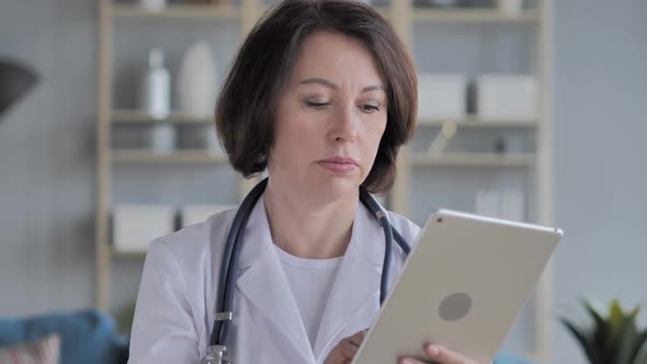 Old Senior Doctor Using Tablet for Browsing Internet, Stock Footage