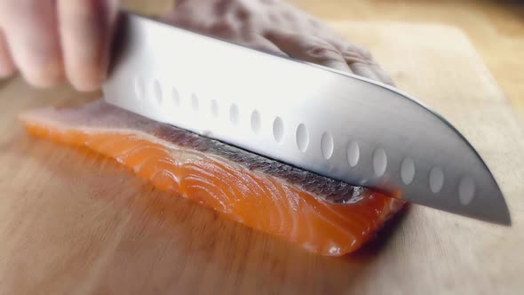 Close Shot of Scoring the Fish Skin on a Salmon Fillet Prior to Cooking ...