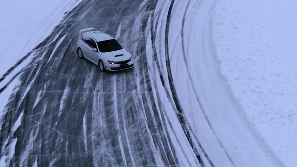 Aerial view of the rally car on a snowy road, Stock Footage | VideoHive
