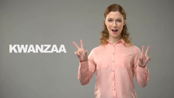 Deaf Lady Saying Kwanzaa in Sign Language, Text on Background ...