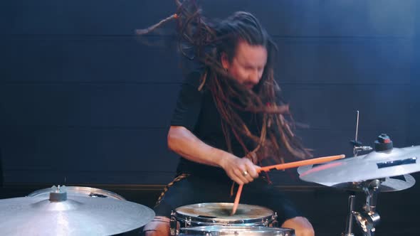 Talented Musician with Dreadlocks Play on Drums in Smoke in a Club ...
