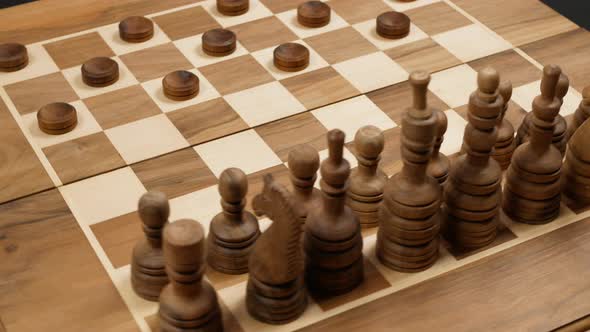 Black Chess Figures Opposite Black Checkers. Spinning Around On The ...