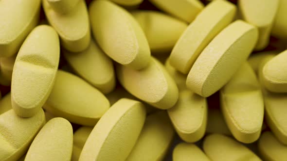 Bright Yellow Antipyretic Tablets Lie Together and Rotate Closeup ...