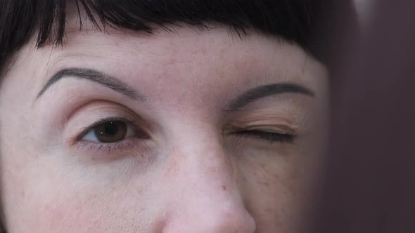 Female Raises Eyebrows Winks Blinks Narrows Eyes Bulges and Closes Her ...