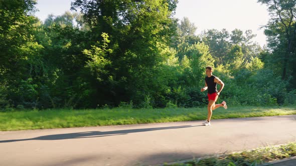 Slow Motion Runner Exercising in Park, Stock Footage | VideoHive