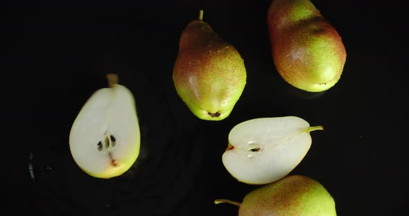 Half of Fresh Pear Rotate on the Water., Stock Footage | VideoHive