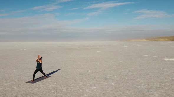 Beautiful brunette girl practicing Yoga in a wild landscape. Vinyasa ...