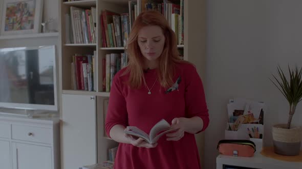 Woman with Book in Home Library, Stock Footage | VideoHive