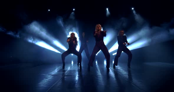 Women Dance on Stage Under Spotlights, Stock Footage | VideoHive